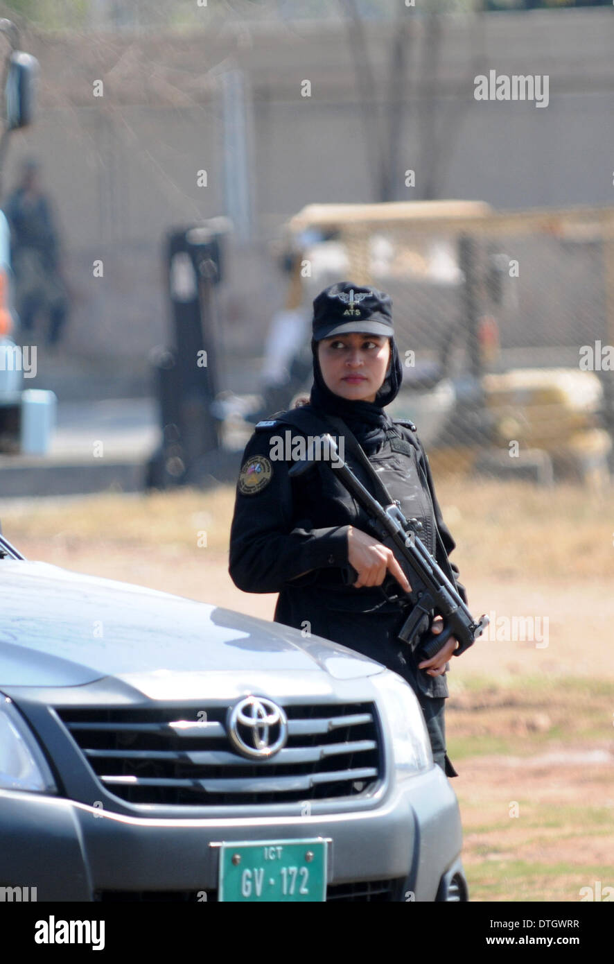 Islamabad. 18th Feb, 2014. A female police commando stands guard during ...