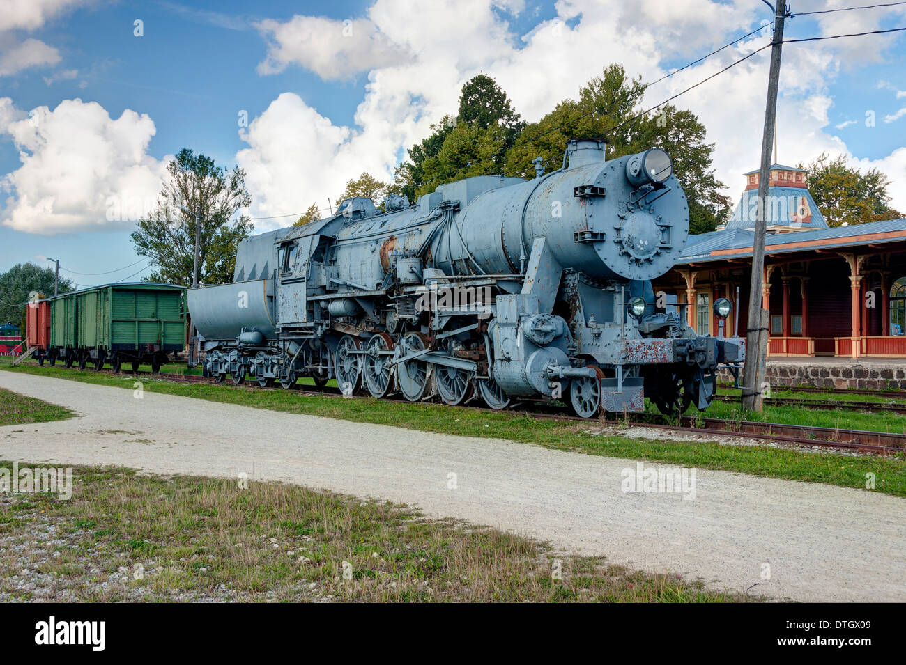Ancient steam locomotive at railway station in summer Stock Photo - Alamy