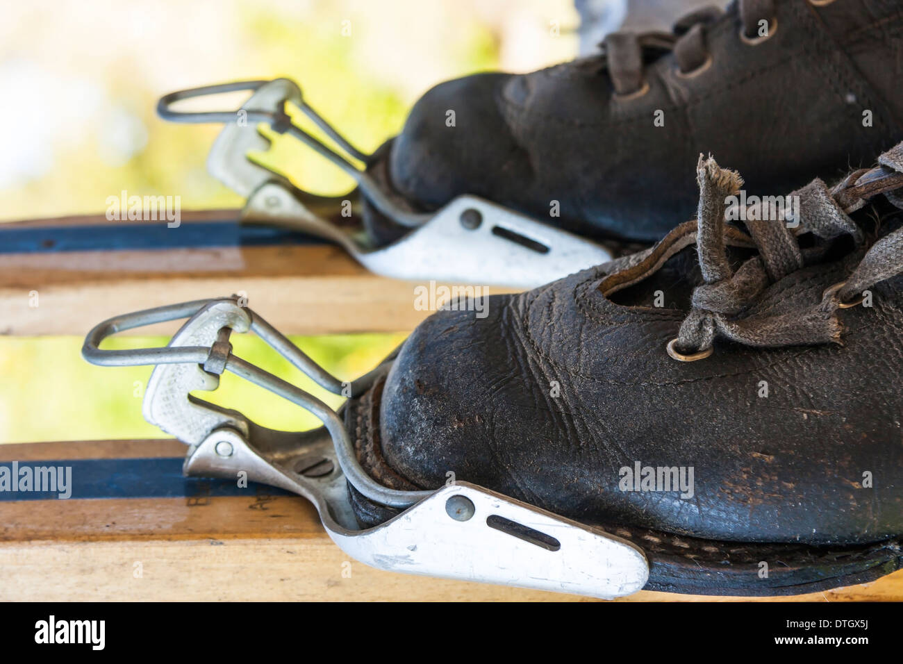 Old black leather ski boots in ancient ski clamps Stock Photo - Alamy