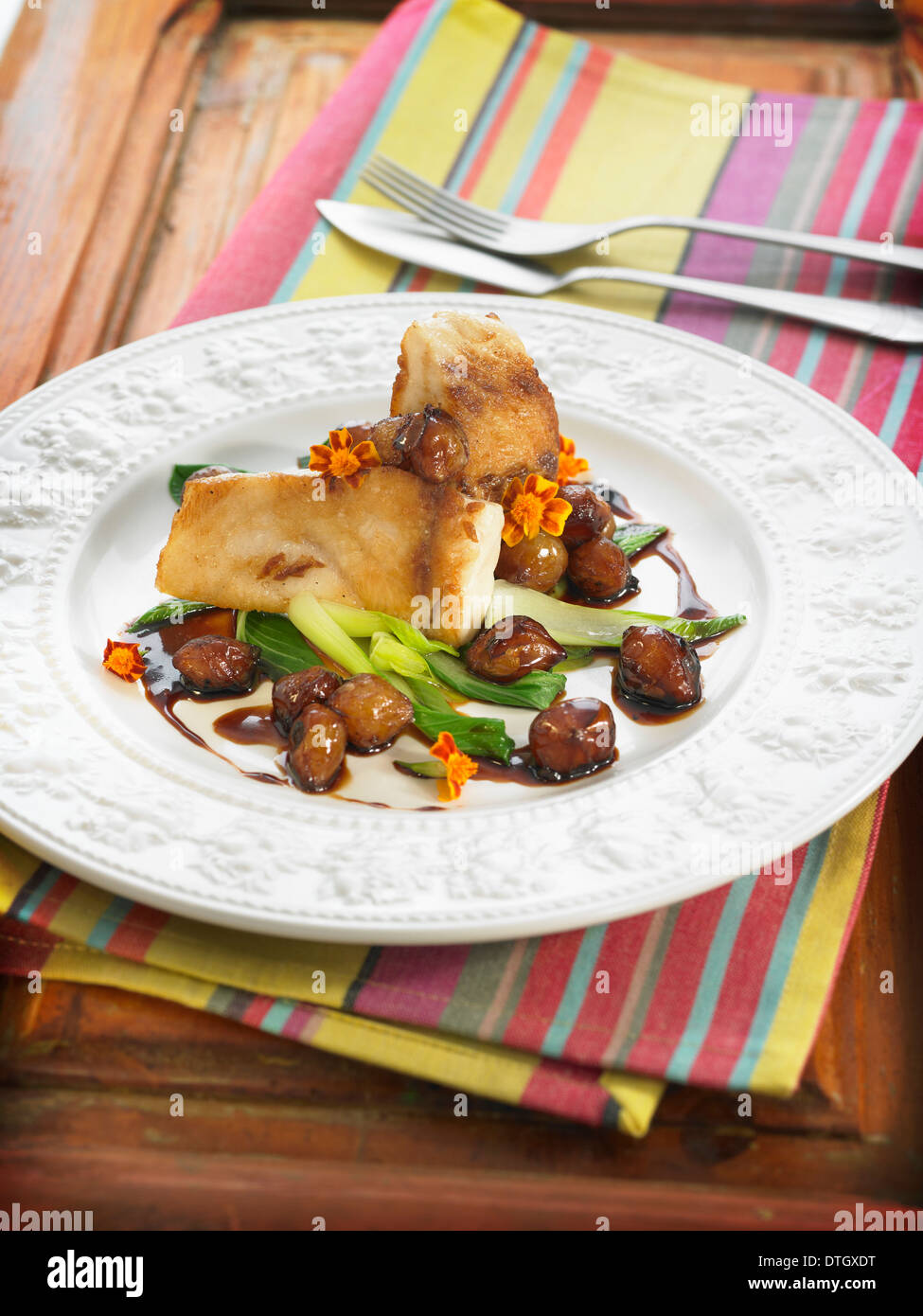 Grouper with onions glazed in red wine,pak-choy cabbage and edible ...