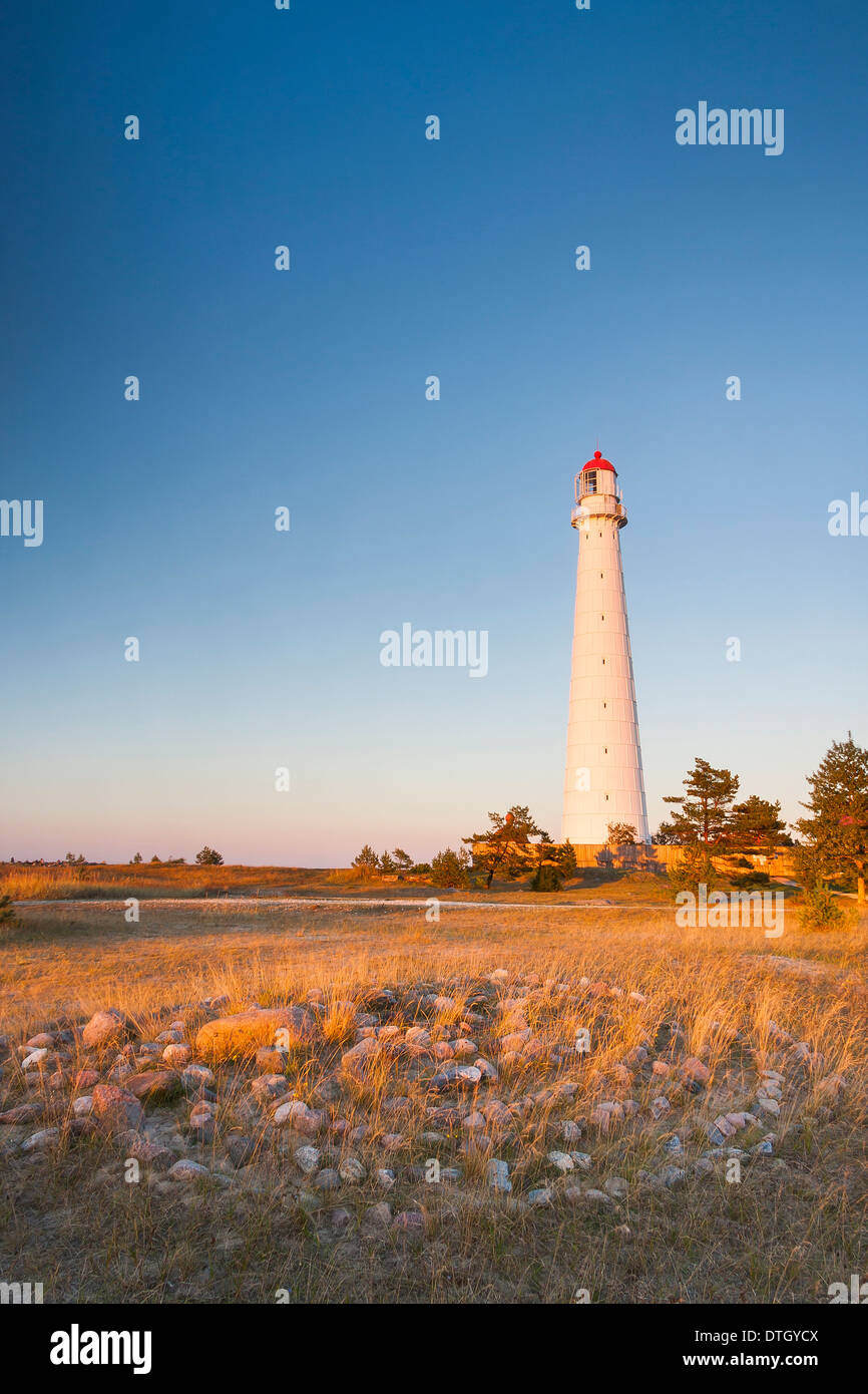 Tall slim white beacon or lighthouse known as Tahkuna at sunset in ...