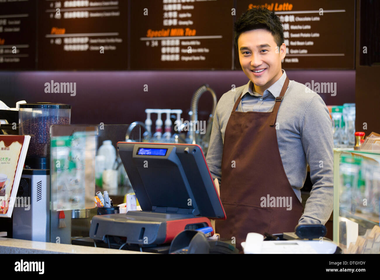 Portrait of male coffee store clerk Stock Photo - Alamy