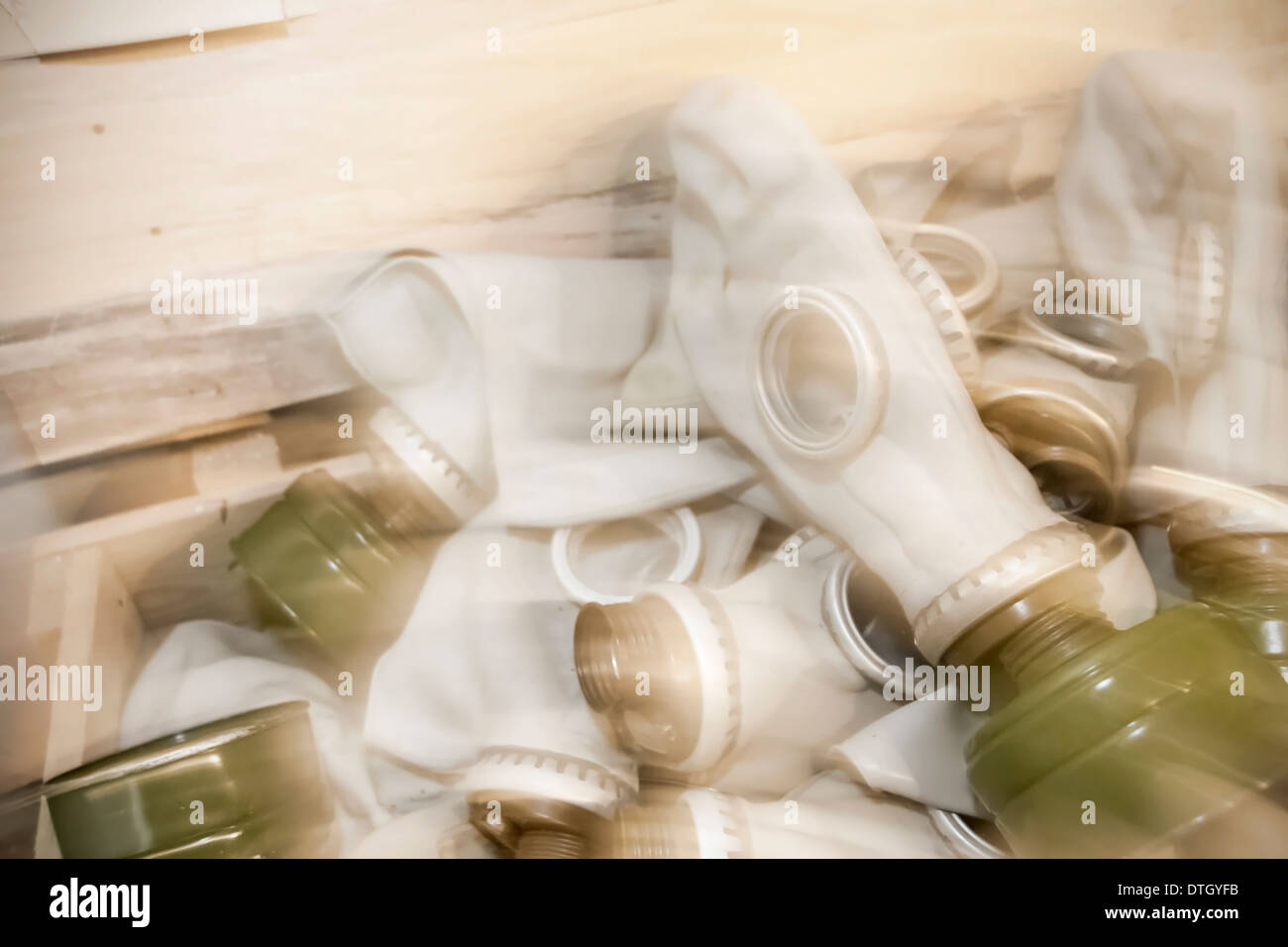 Many gas masks with green balloon in a chest Stock Photo - Alamy