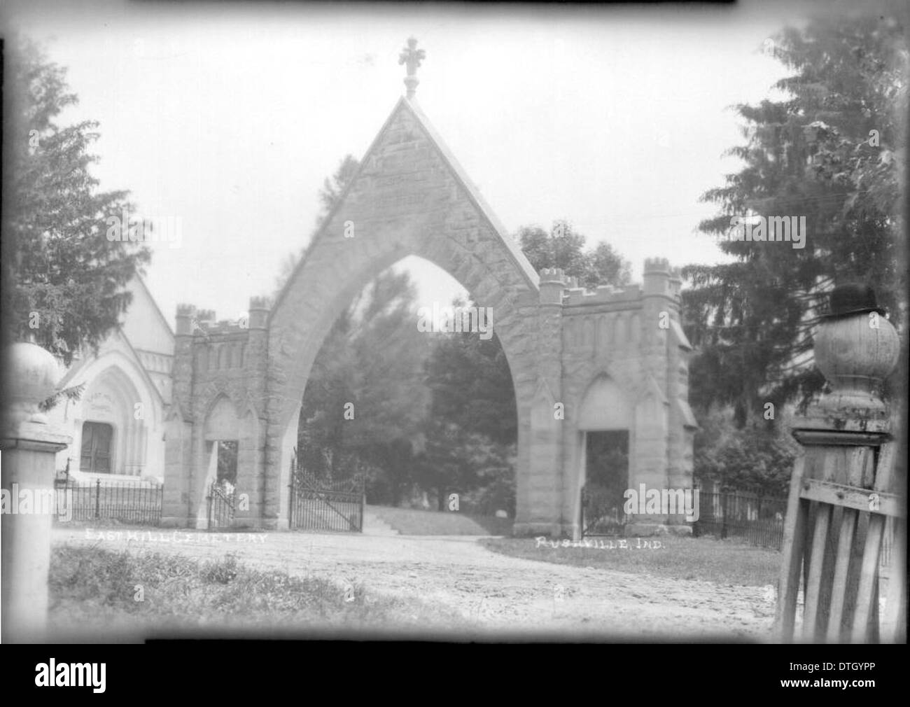 This photograph shows the entrance to East Hill Cemetery, featuring ...