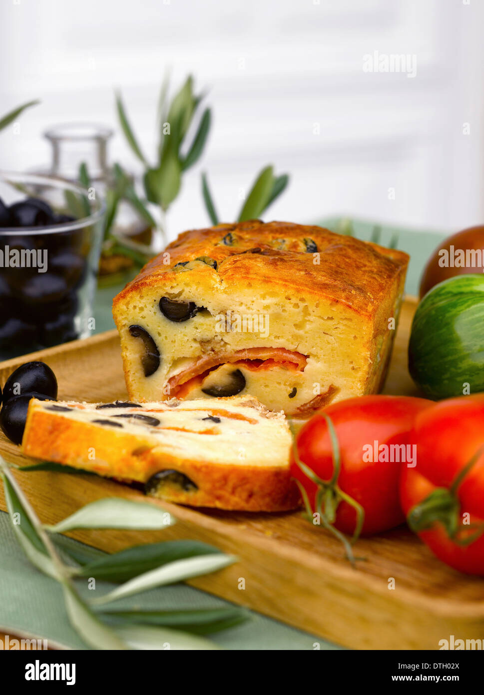 Tomato,olive and anchovy savoury cake Stock Photo - Alamy