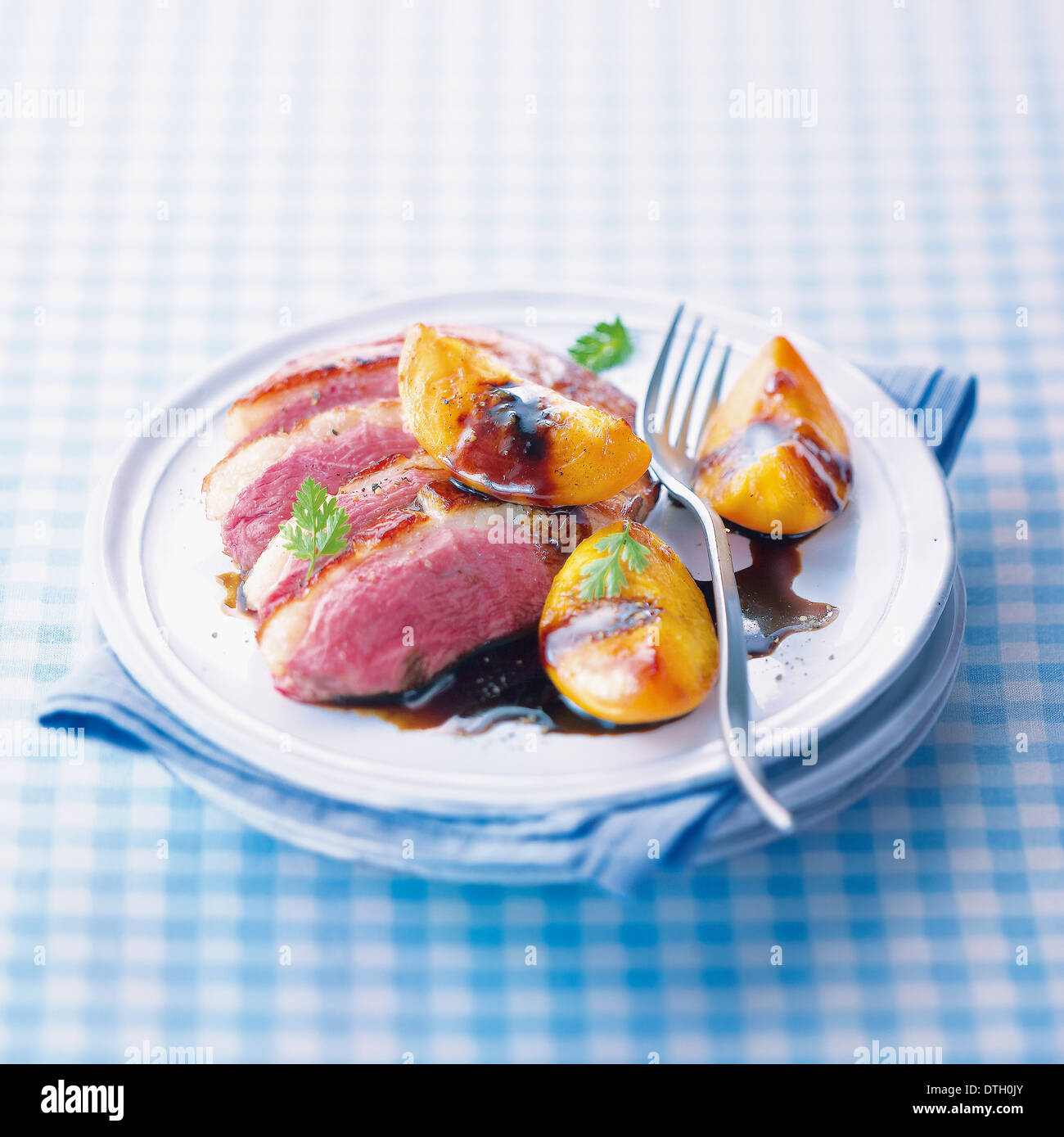 Duck magret with peaches Stock Photo - Alamy