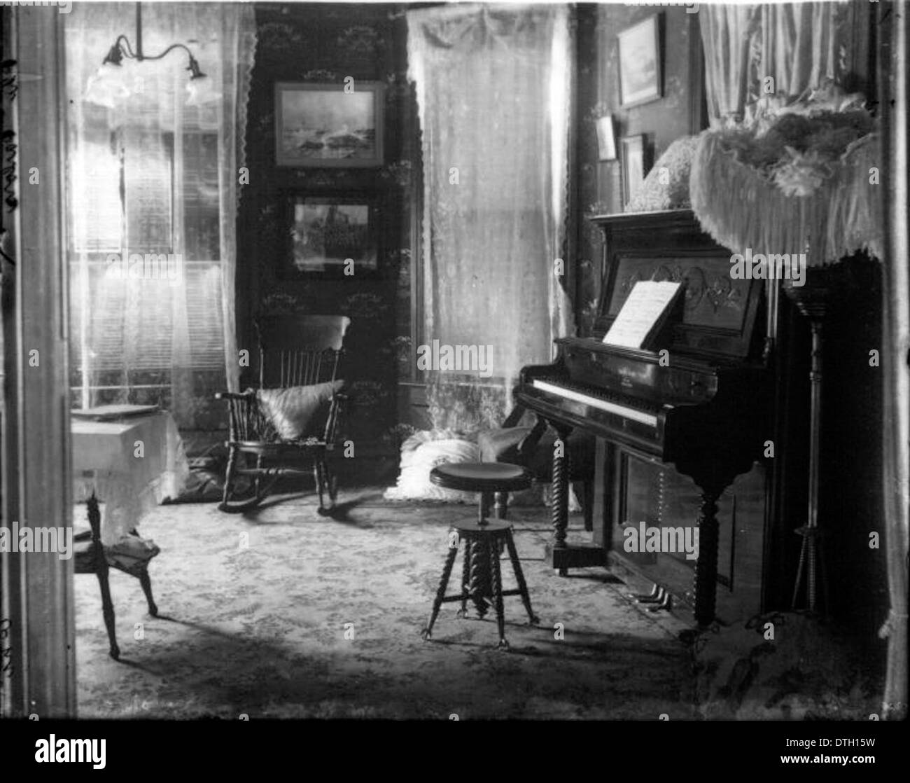 A partial view of a historic parlor, featuring furniture typical of the ...