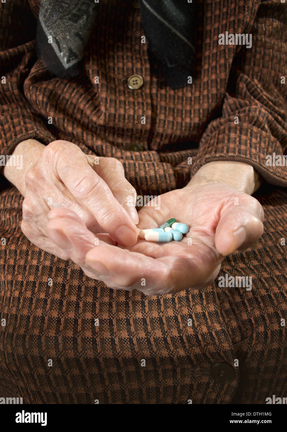 Senior woman holding assorted capsules in her hands conceptual of ...