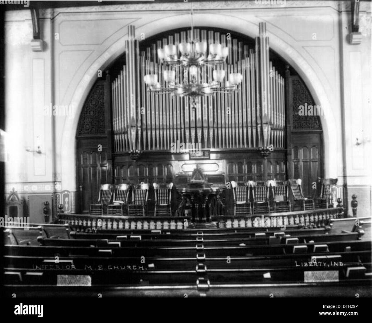 A historical image showing the interior of a Methodist Episcopal Church ...