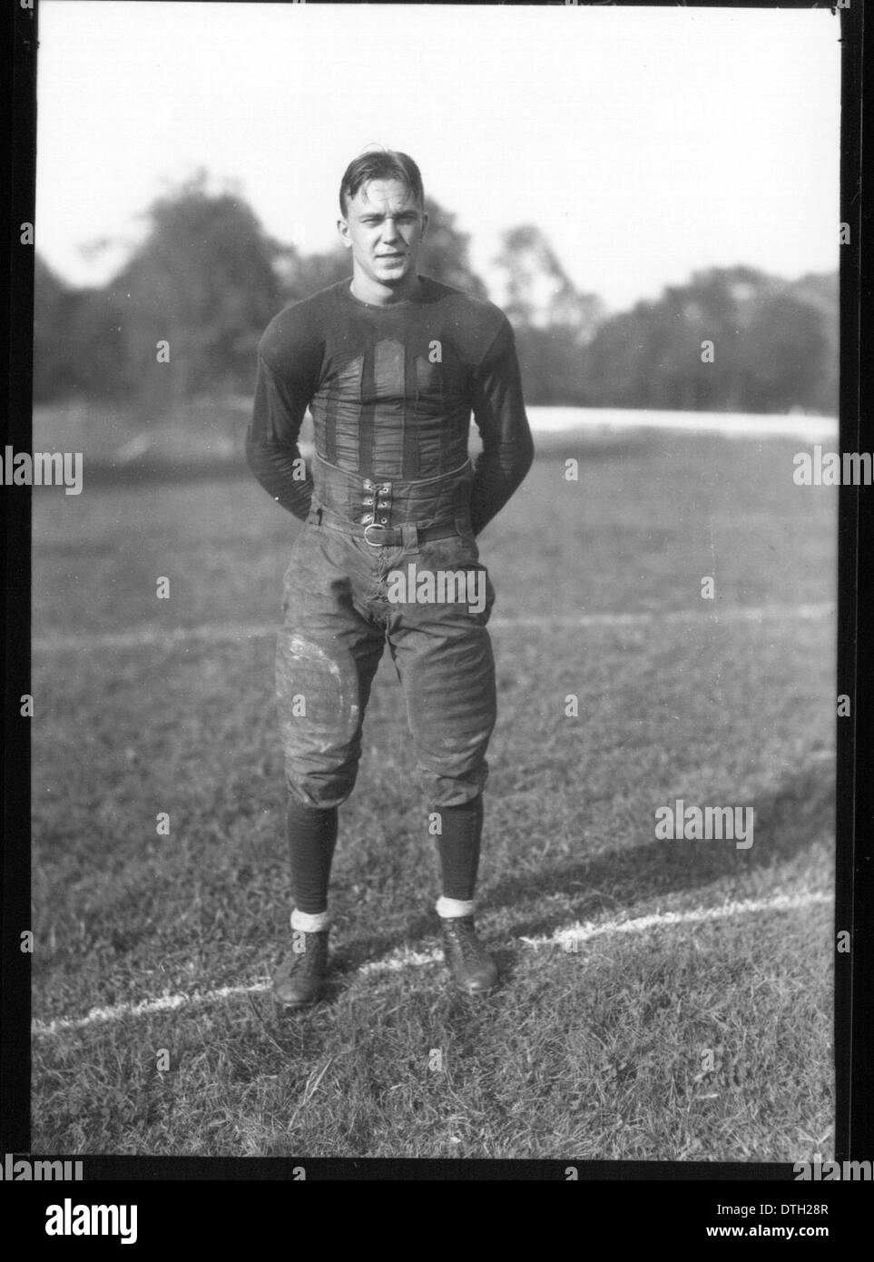 A portrait of Robert H. Whittaker in his football uniform from 1926 ...
