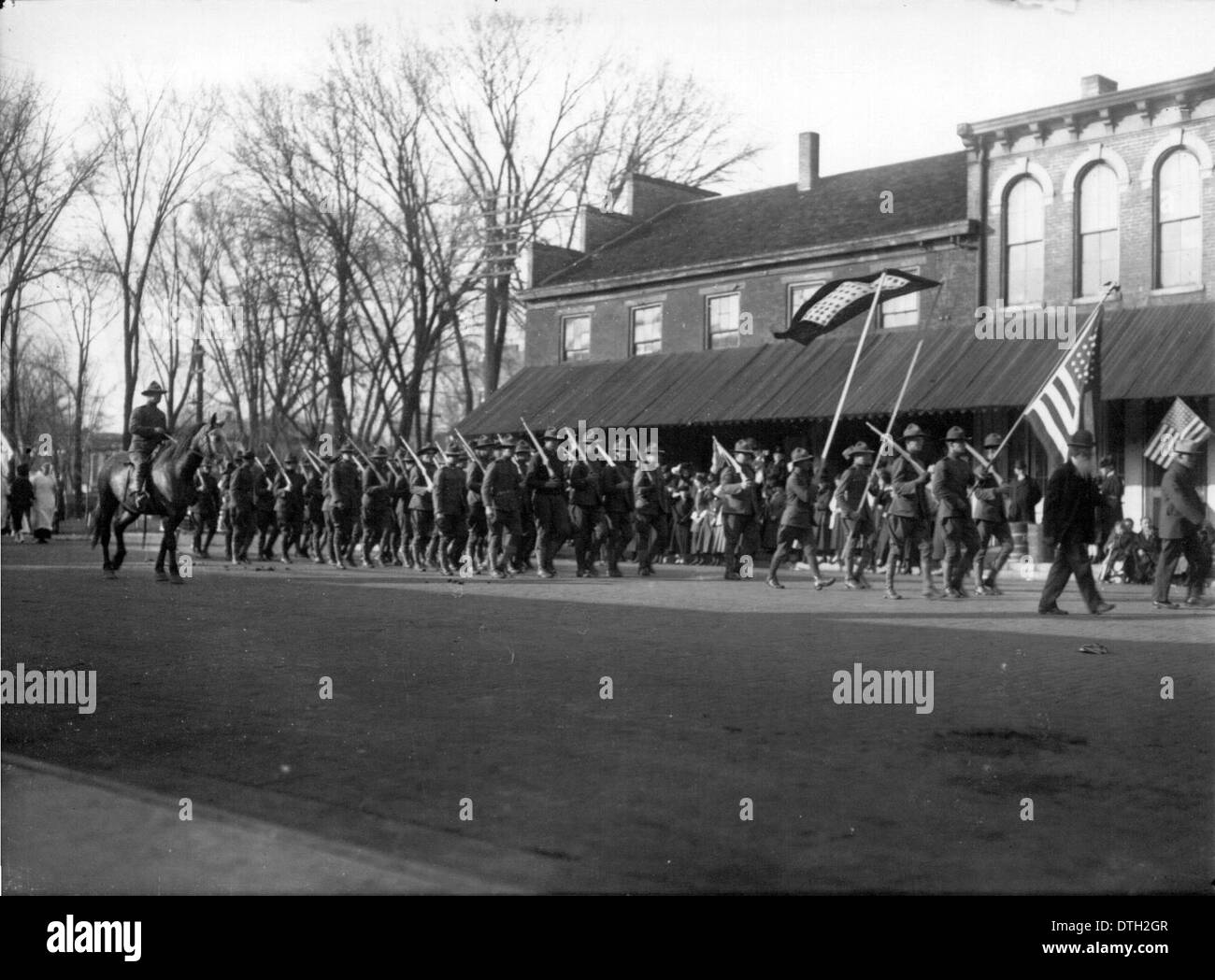 This 1918 photograph captures military men marching in the Armistice ...