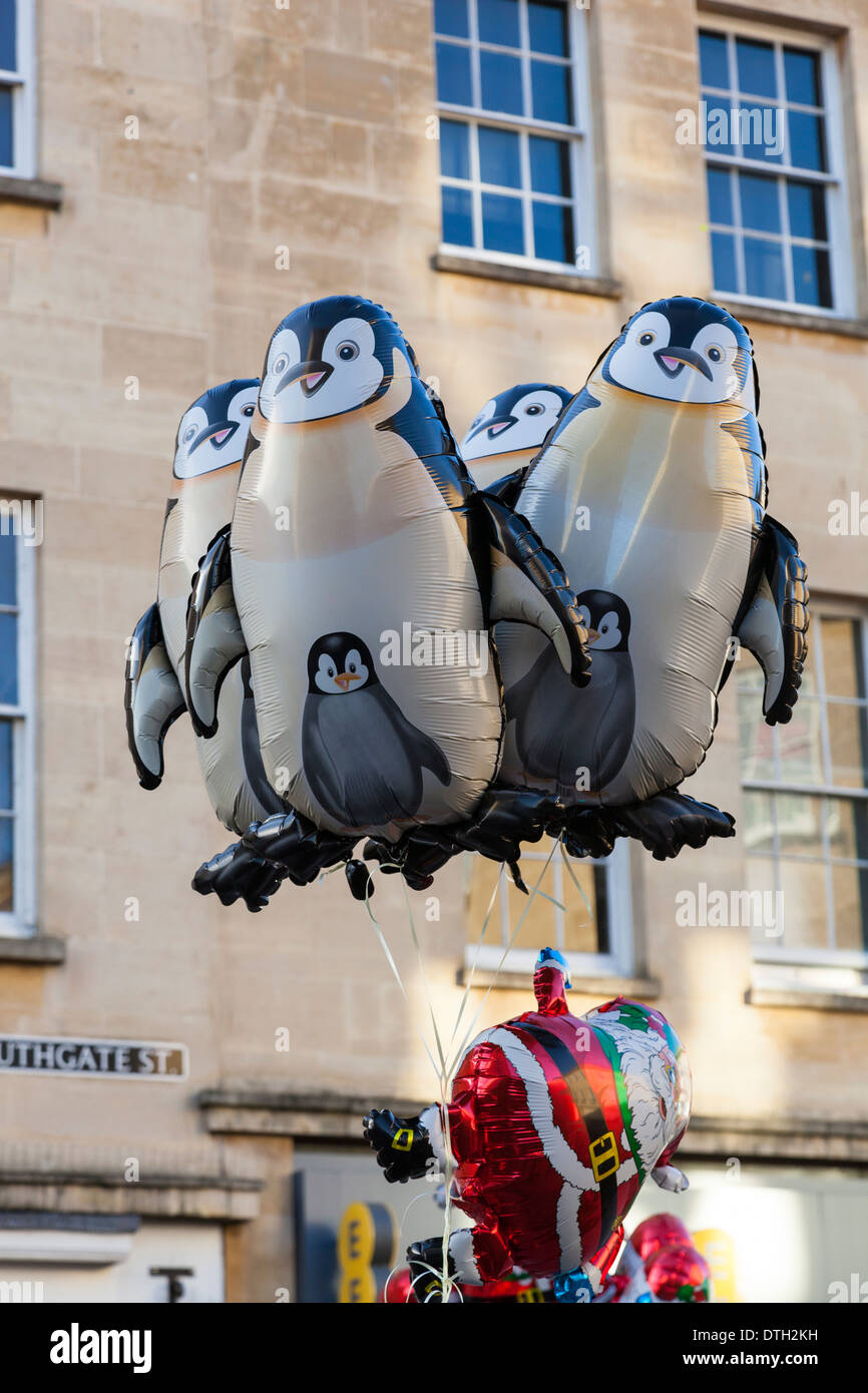 A group of inflatable helium filled penguins form part of a display of ...