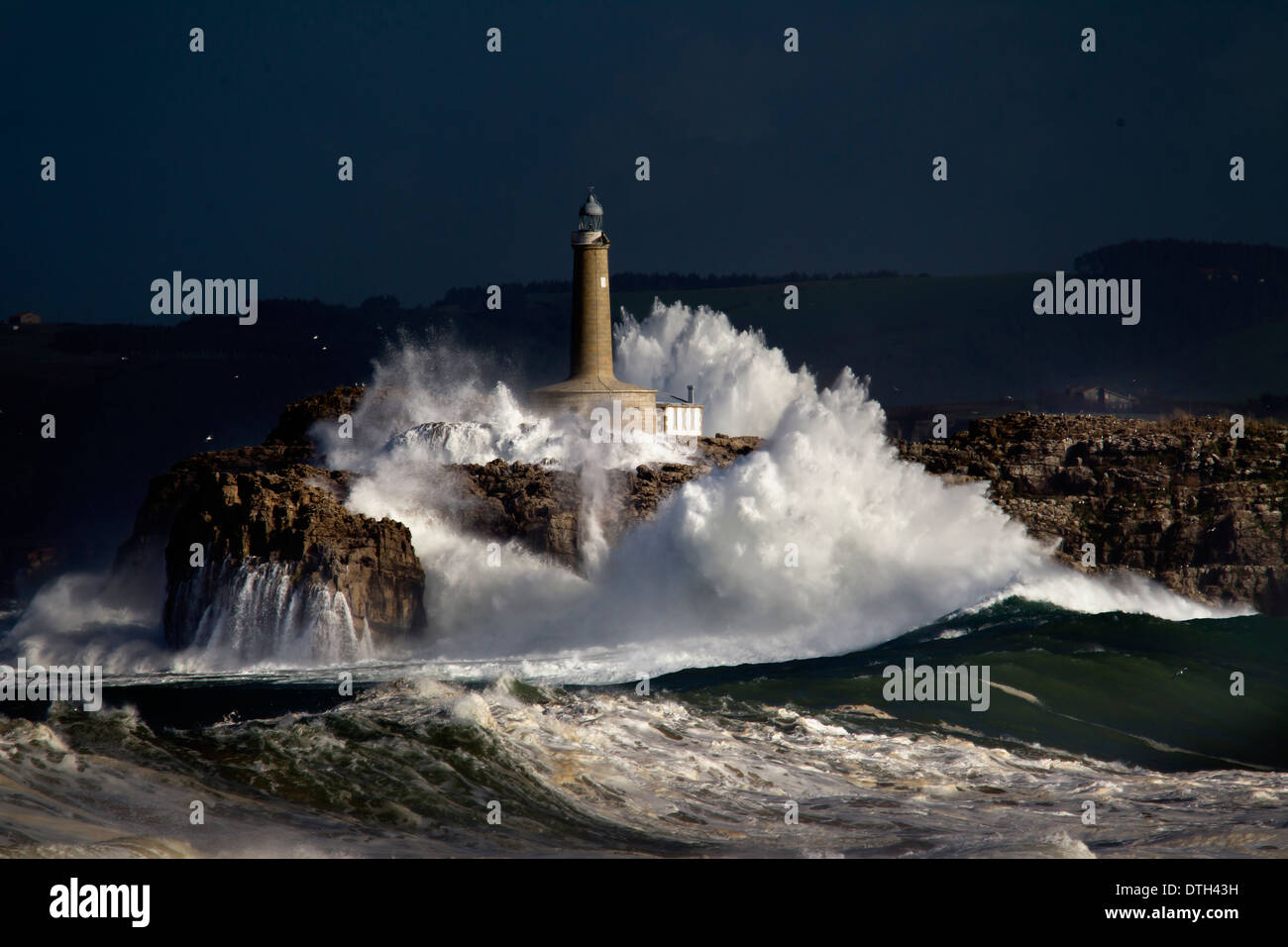 The Mouro island lighthouse in the big storm Stock Photo - Alamy