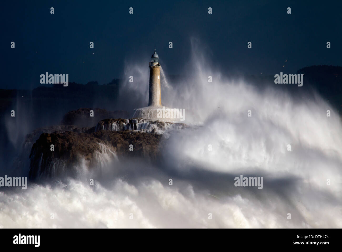 The Mouro island lighthouse in the big storm Stock Photo - Alamy