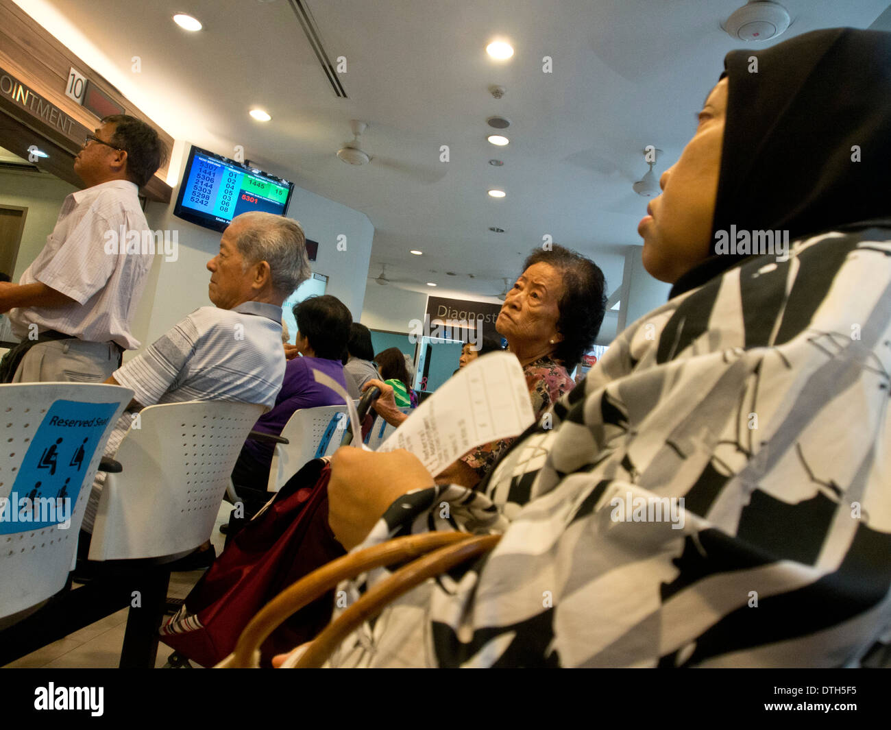 Patients waiting to be attended by doctors at a polyclinic medical ...