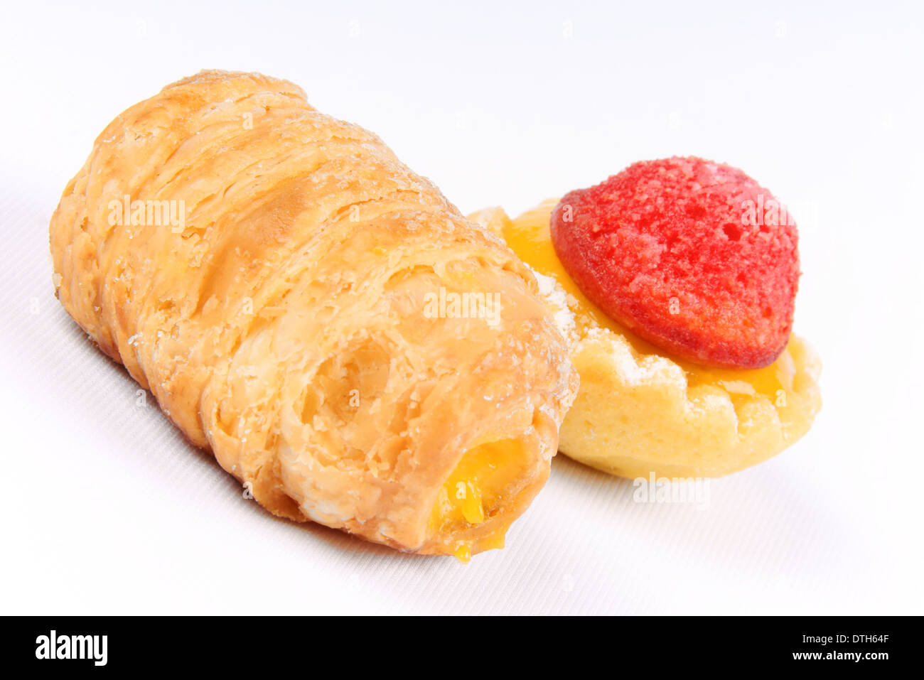 Assorted tea cakes on a white fabric background Stock Photo - Alamy