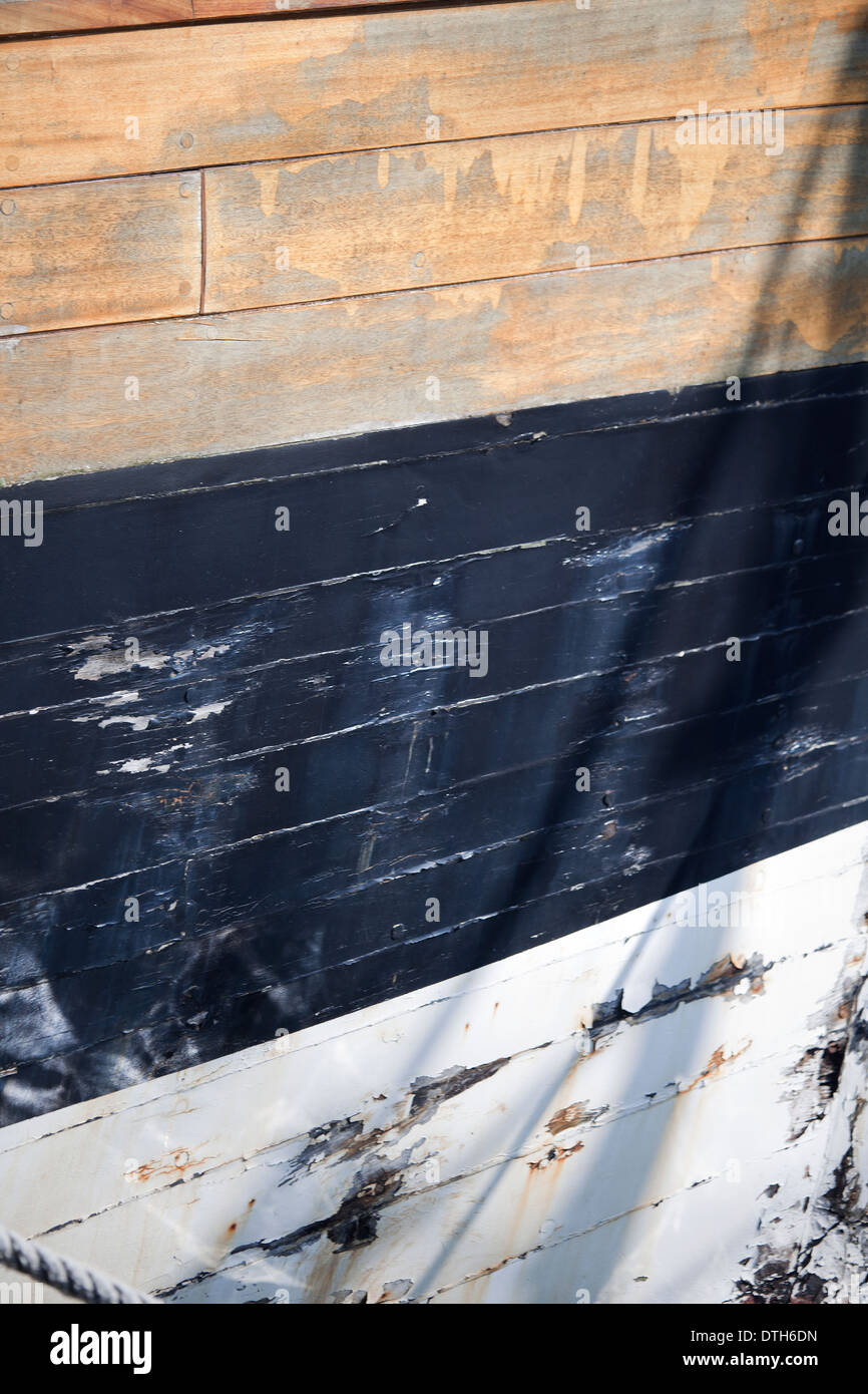 an old boat hull, painted in different colors Stock Photo - Alamy