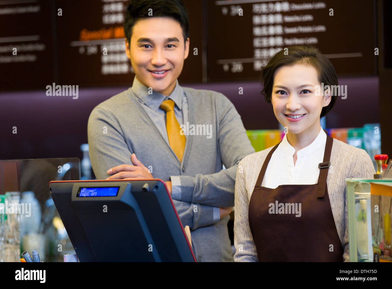 Portrait of coffee store shopkeeper and waitress Stock Photo - Alamy