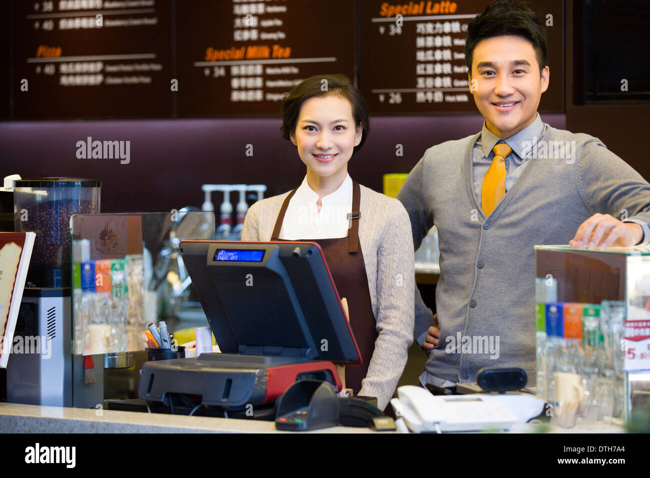 Portrait of coffee store shopkeeper and waitress Stock Photo - Alamy