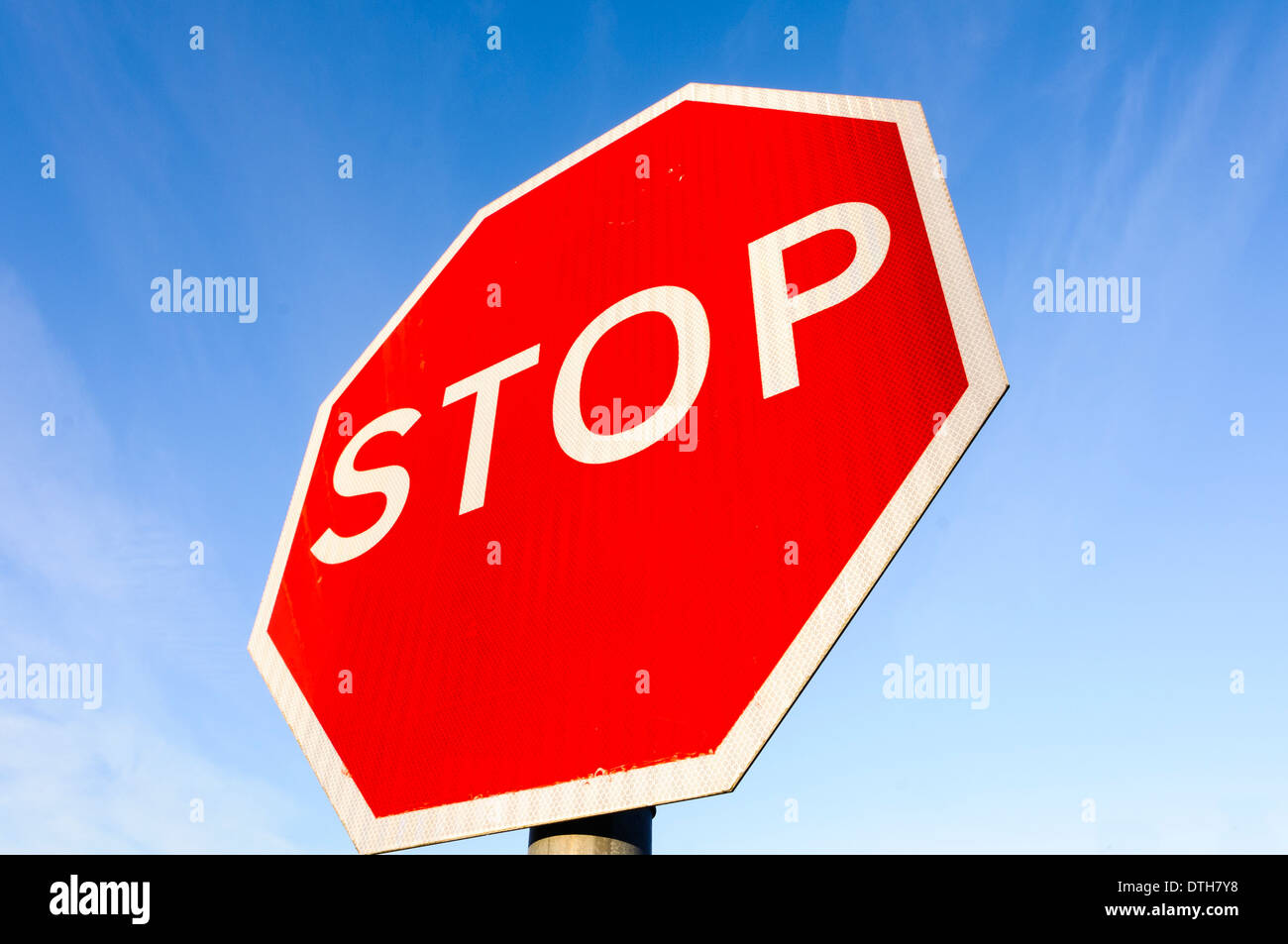 "STOP" road traffic sign against a blue sky Stock Photo - Alamy