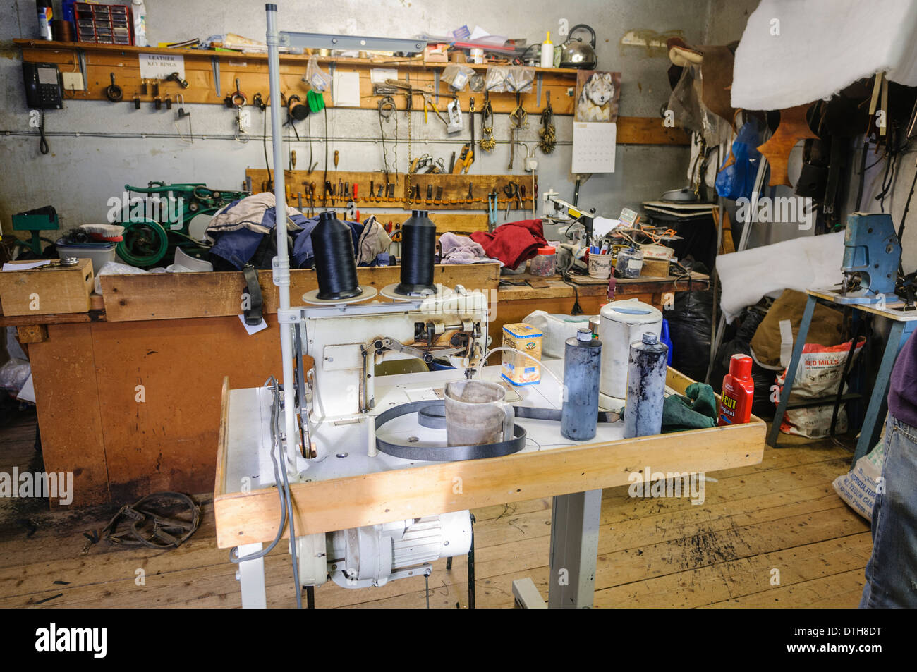A saddler's workshop with heavy duty sewing machine to sew leather ...