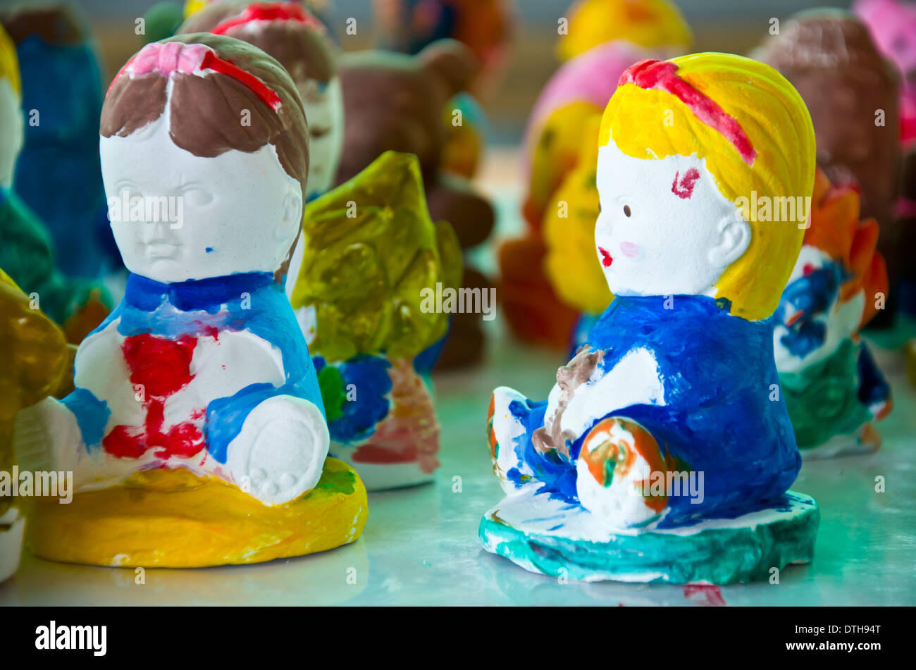 stone craft of doll art from children Stock Photo - Alamy