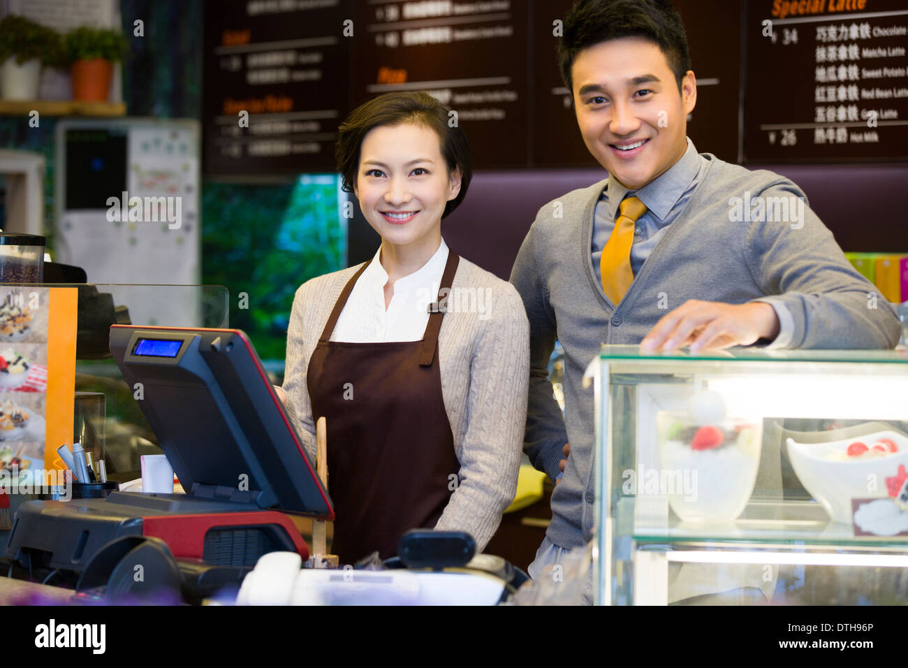 Portrait of coffee store shopkeeper and waitress Stock Photo - Alamy