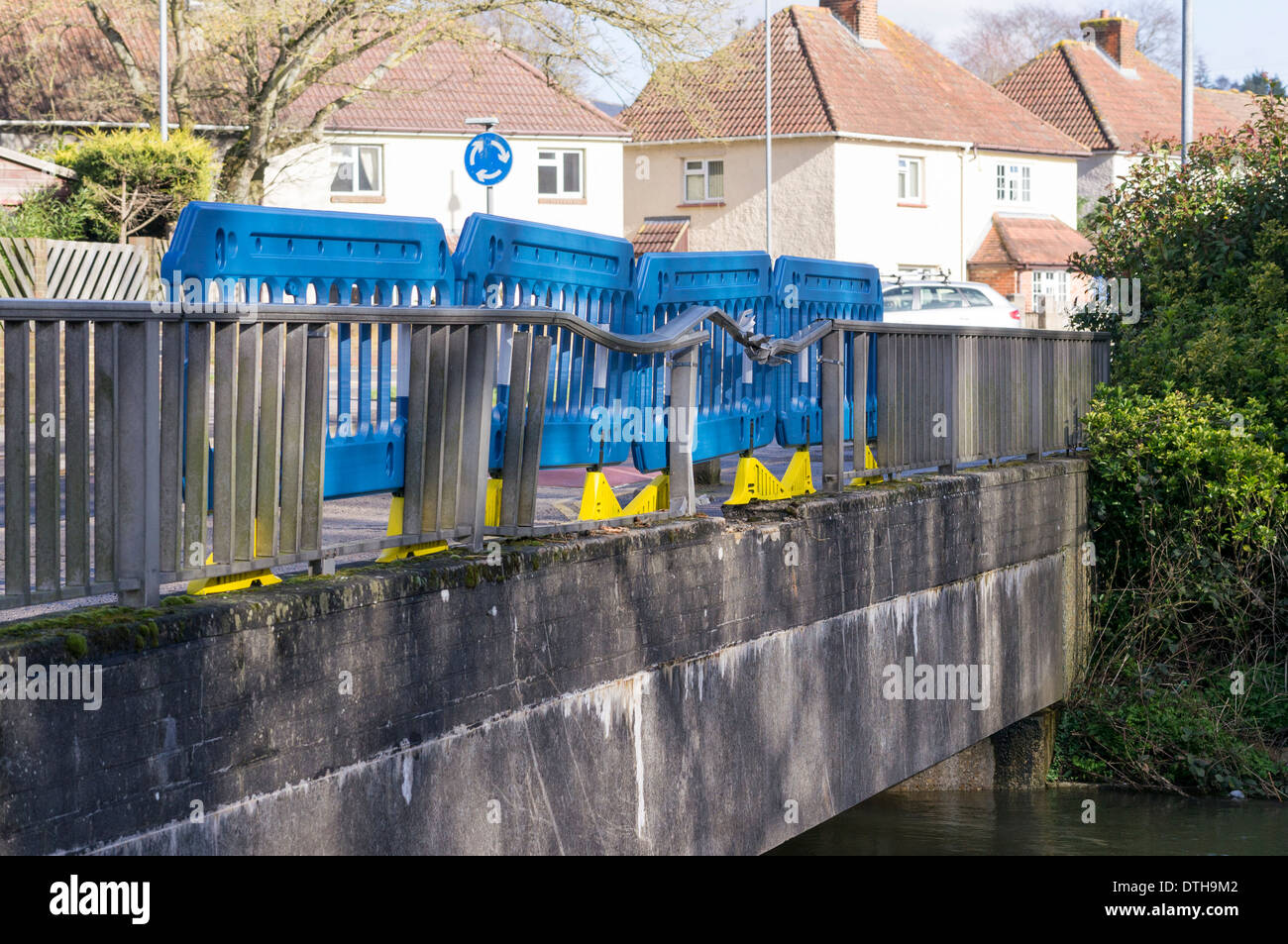 Temporary blue plastic safety barrier on river bridge Stock Photo - Alamy