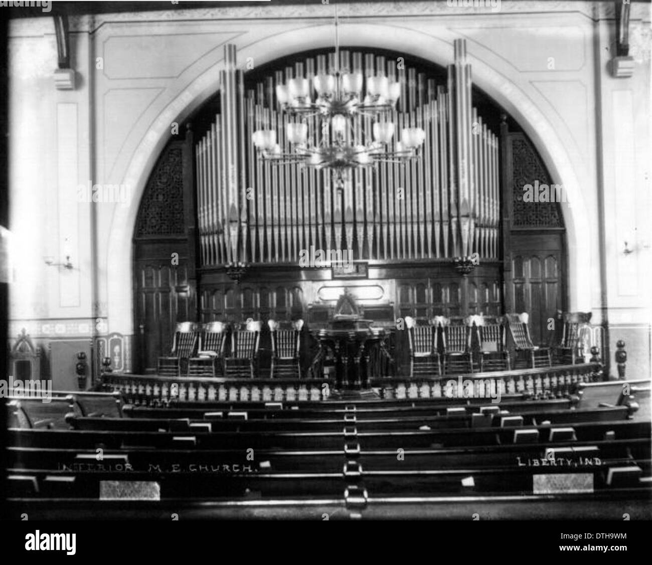 This historic photograph captures the interior of a Methodist Episcopal ...