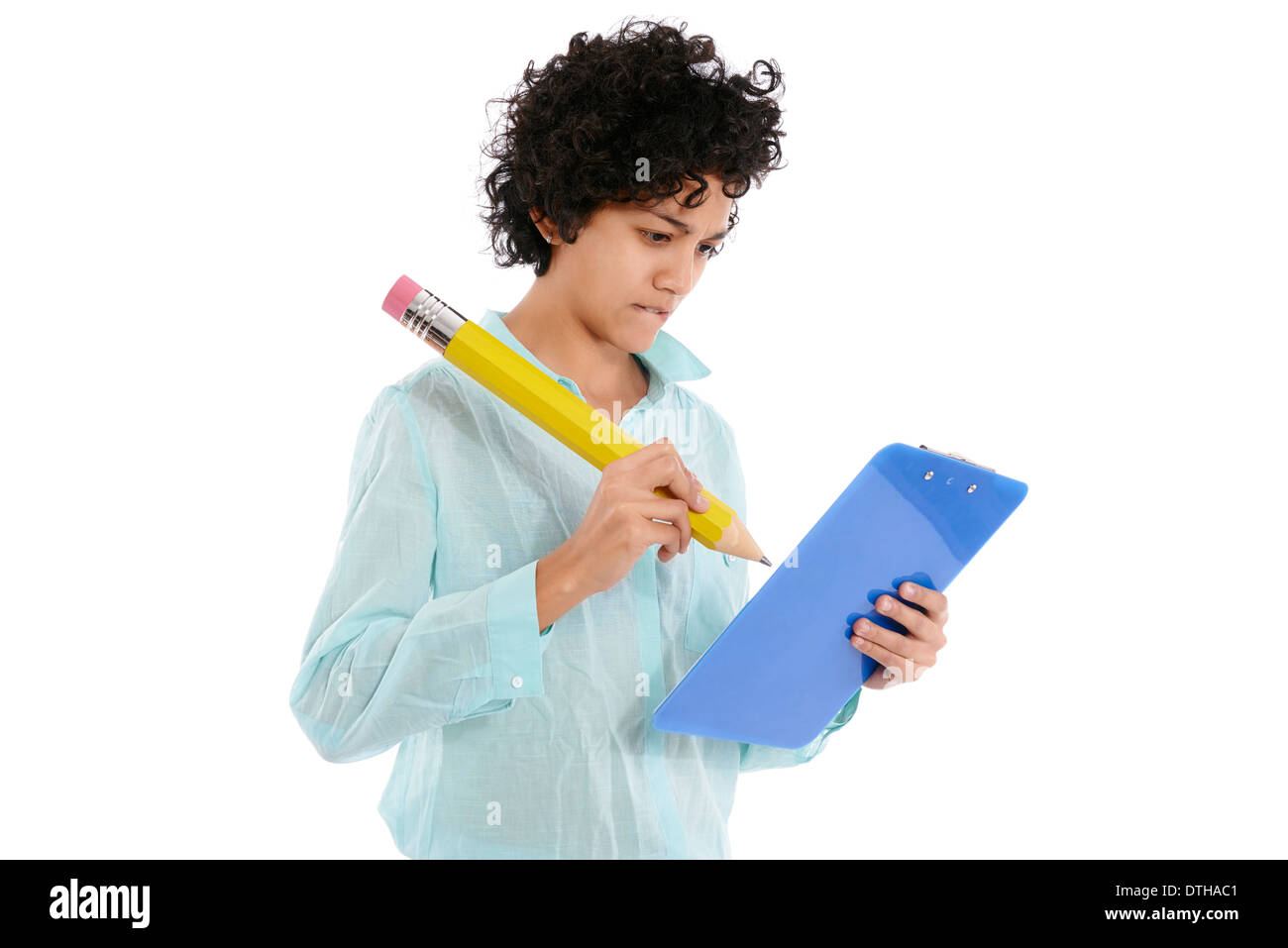hispanic business woman taking notes with huge yellow pencil on white ...