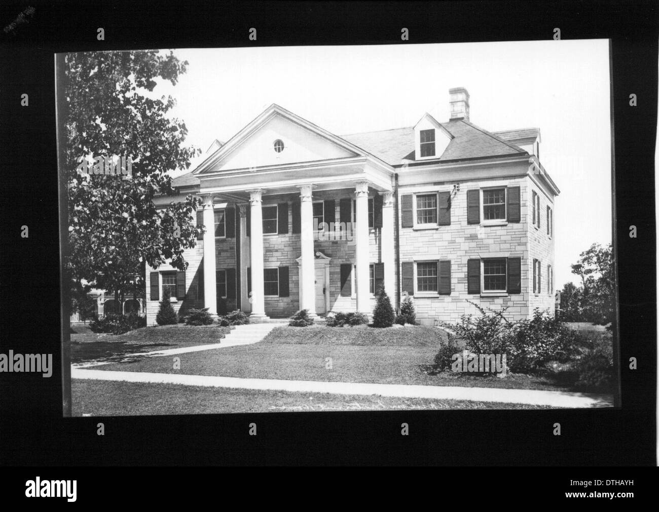 This historical photograph depicts the Delta Upsilon fraternity house ...