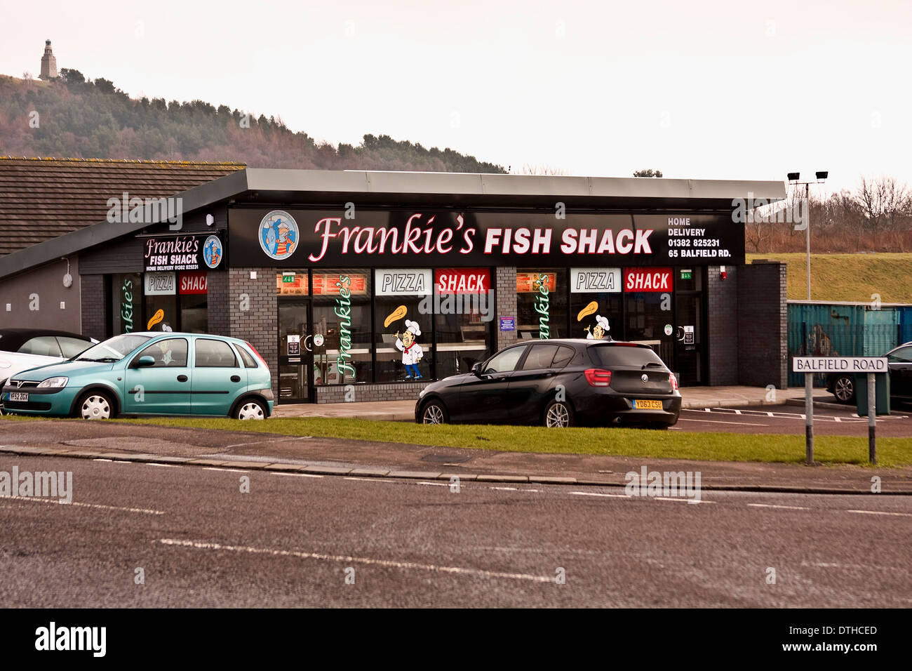 Customers vehicles parked outside the local Frankie`s Fish Shack diner ...