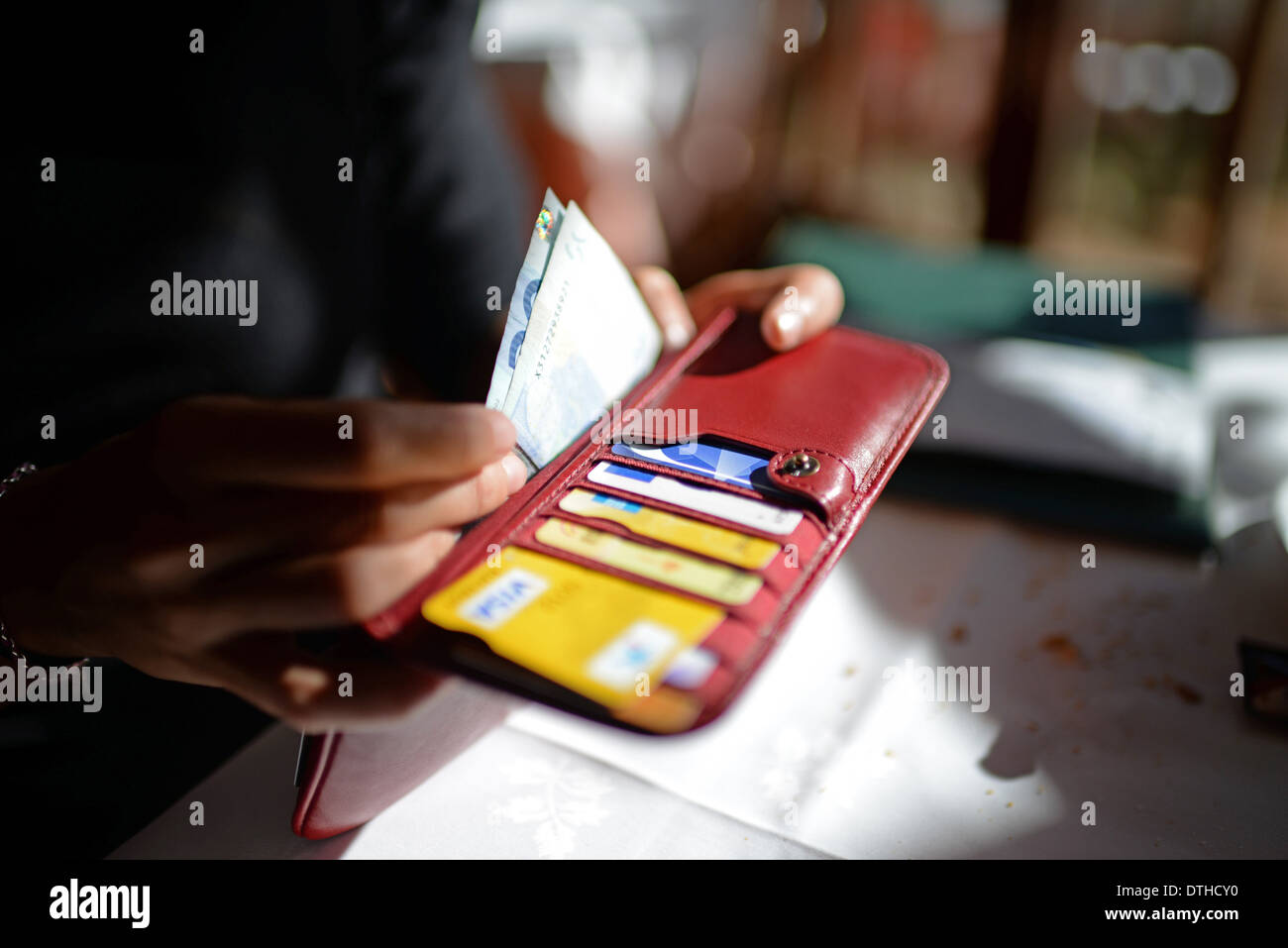 Wallet money hand takes out hi-res stock photography and images - Alamy