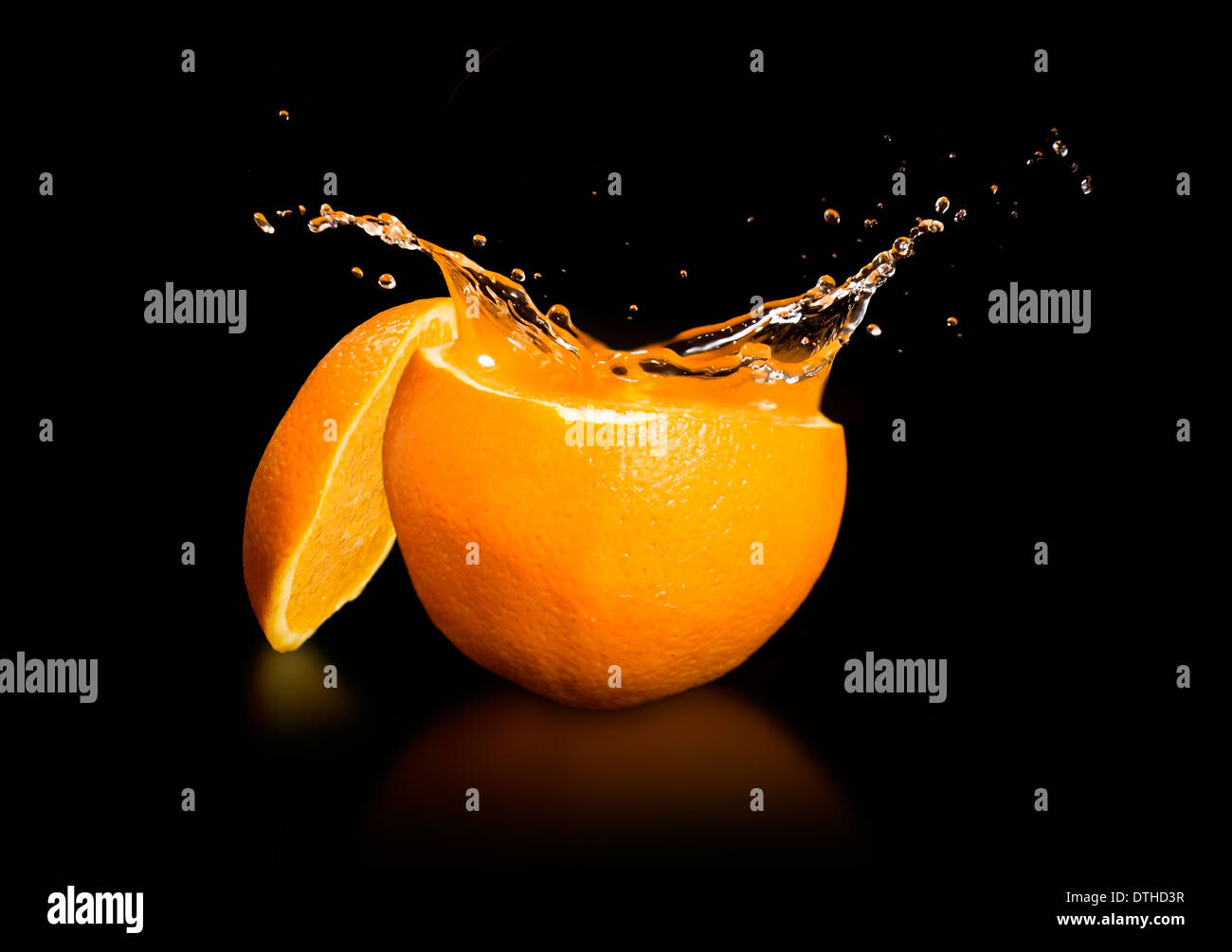 Orange juice splash on black hi-res stock photography and images - Alamy
