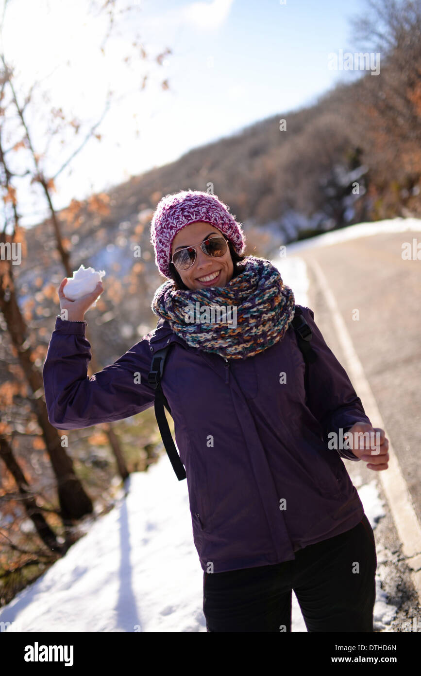 Girl playing snowball hi-res stock photography and images - Alamy