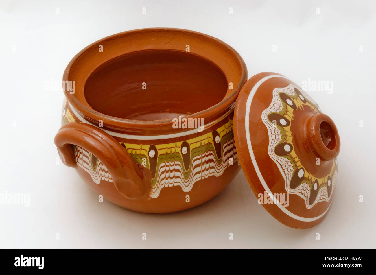 Closeup of mottled with patterns empty clay pot for cooking Stock Photo ...