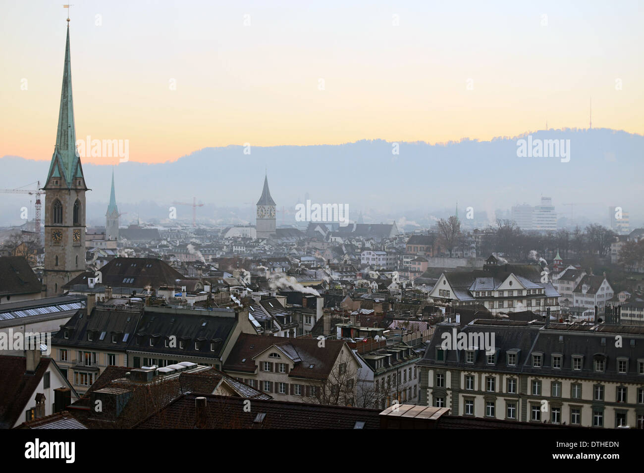View of Zurich from above - misty winter evening and smoke Stock Photo ...
