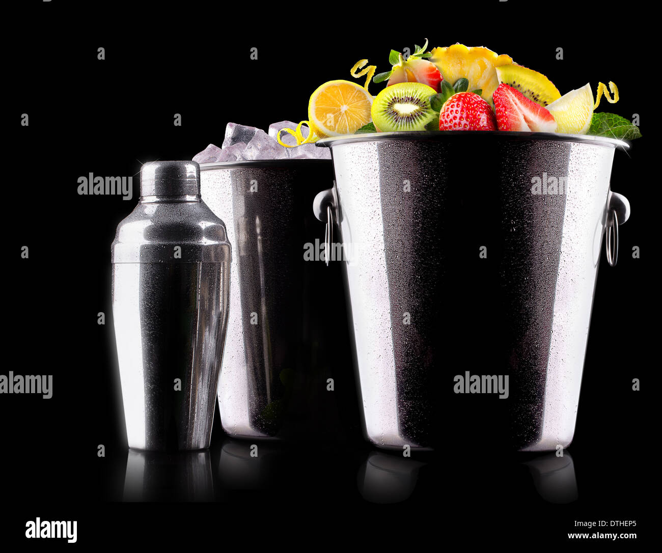 tasty summer fruits in bucket on a black background Stock Photo - Alamy