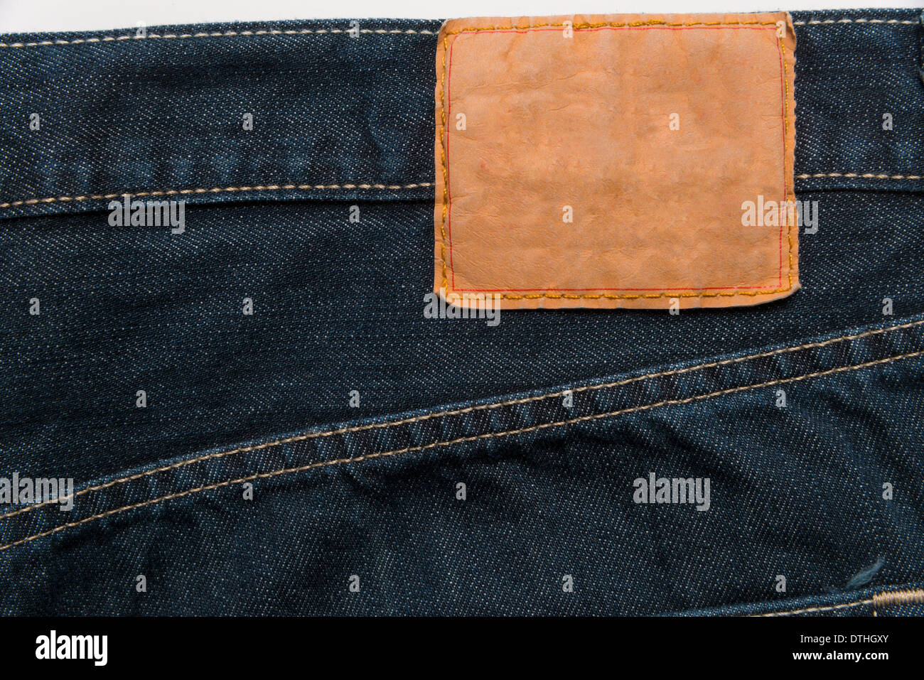 Blue Denim jeans with label used as a background Stock Photo - Alamy