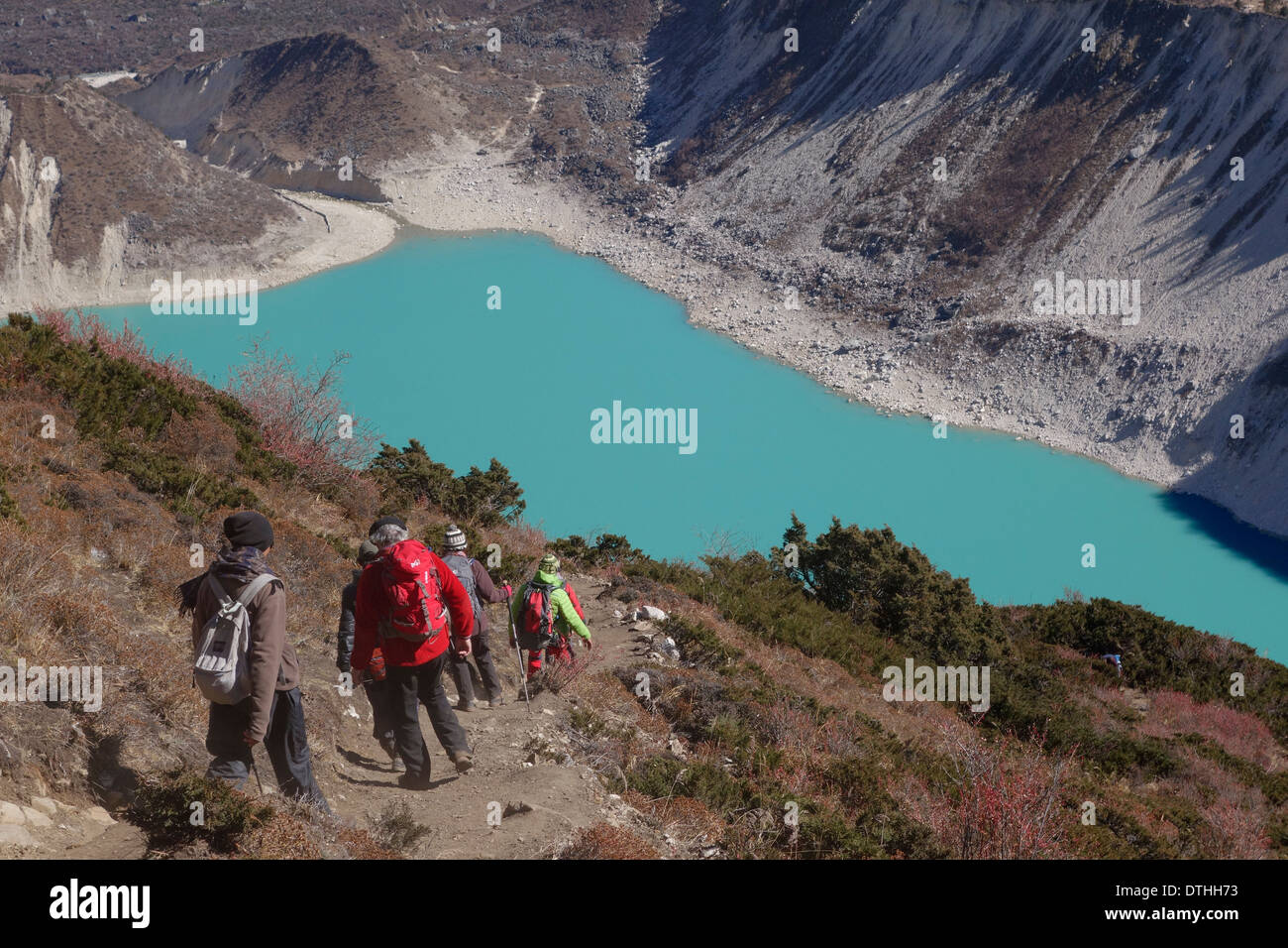 Hikers descending a steep trail above Birendra Tal (lake) in the ...