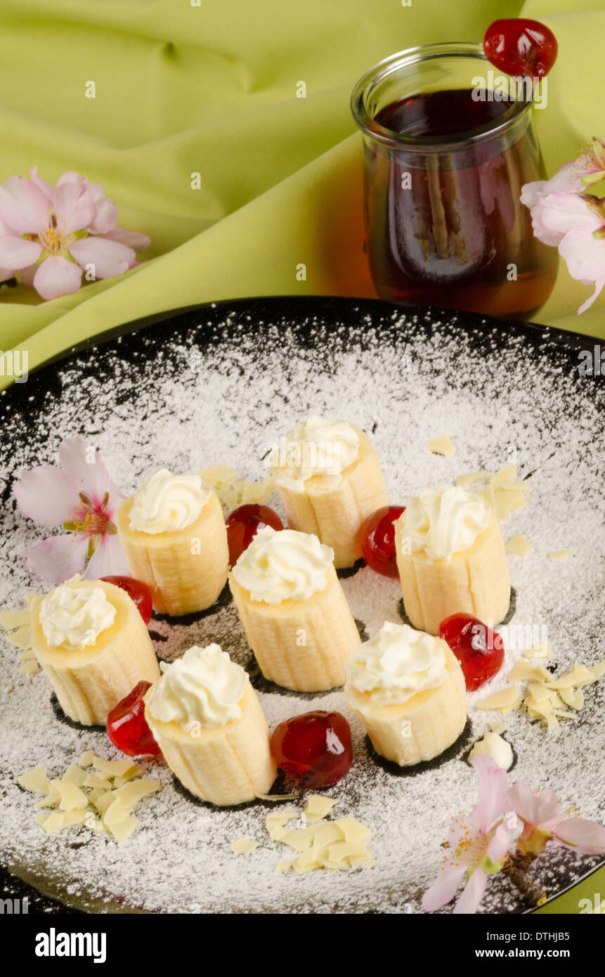 Fruity kid dessert with bananas and morello cherries Stock Photo - Alamy