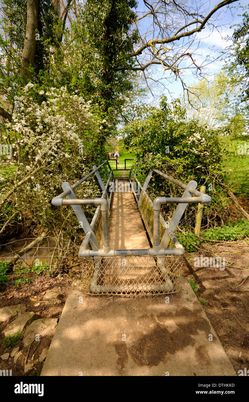 Metal bridge crossing brook leading to 'The 99 Steps' at Lower Brailes ...
