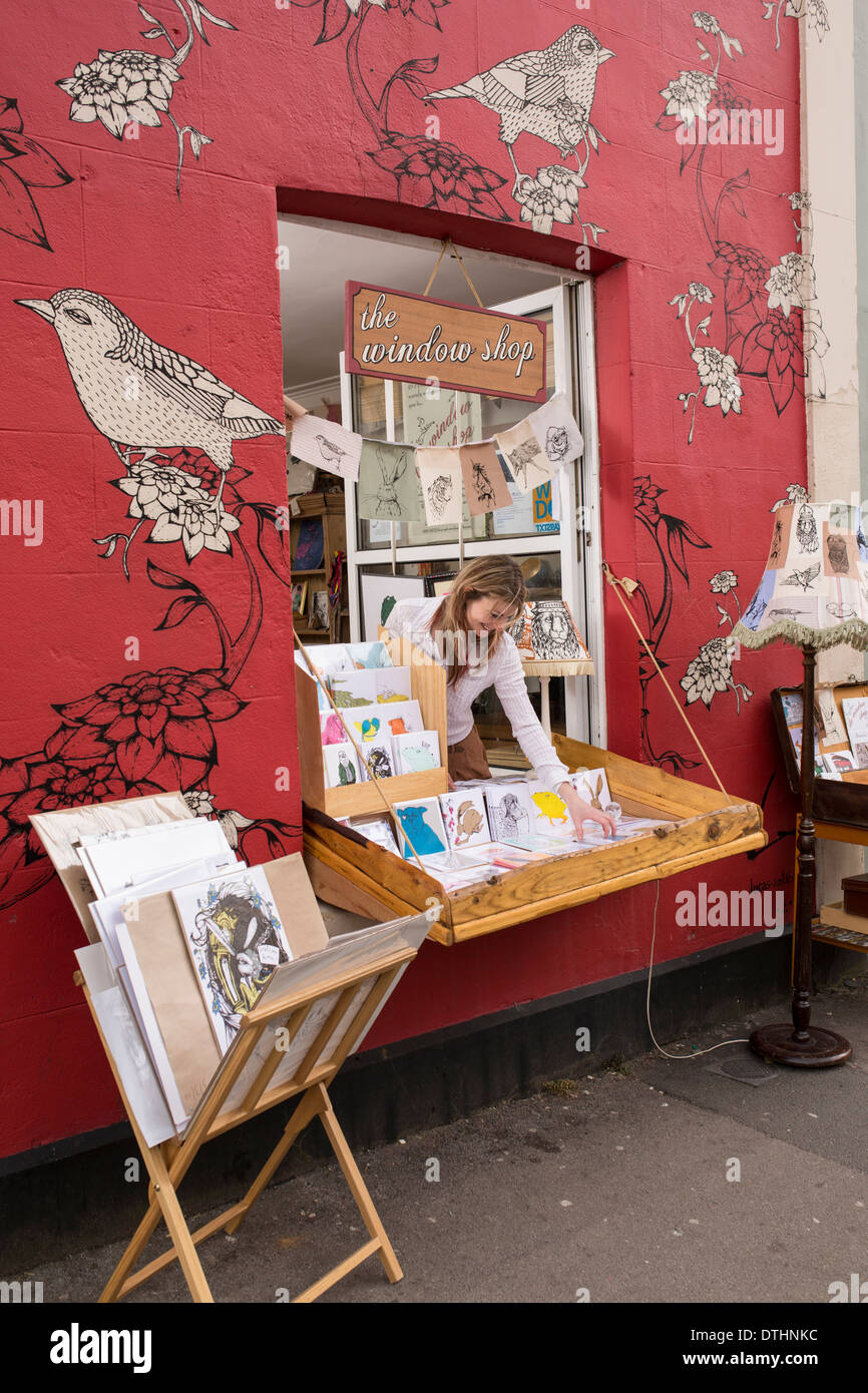 Illustrator designer with pop up shop out of her front window in ...