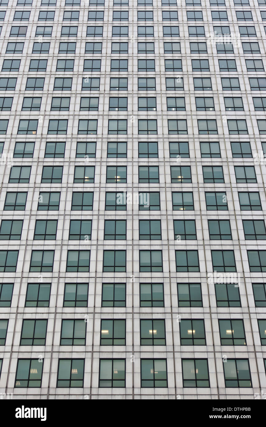 A color image of rows of glass windows of a modern office building in ...