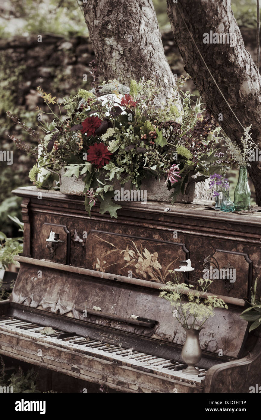 rustic flower arrangements on location in a walled garden Stock Photo ...