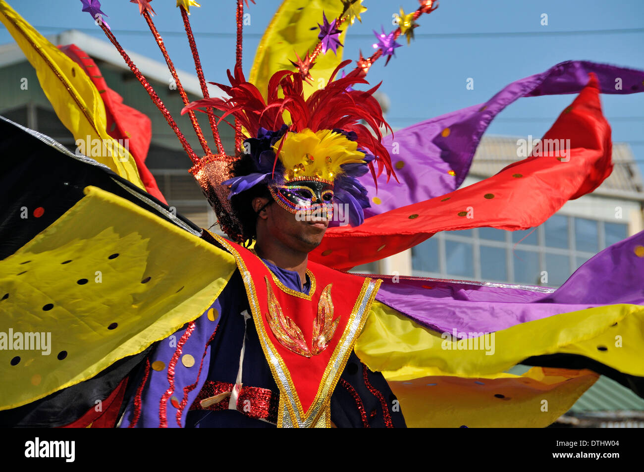 Masquerader at carnival celebration in the streets of Scarborough ...