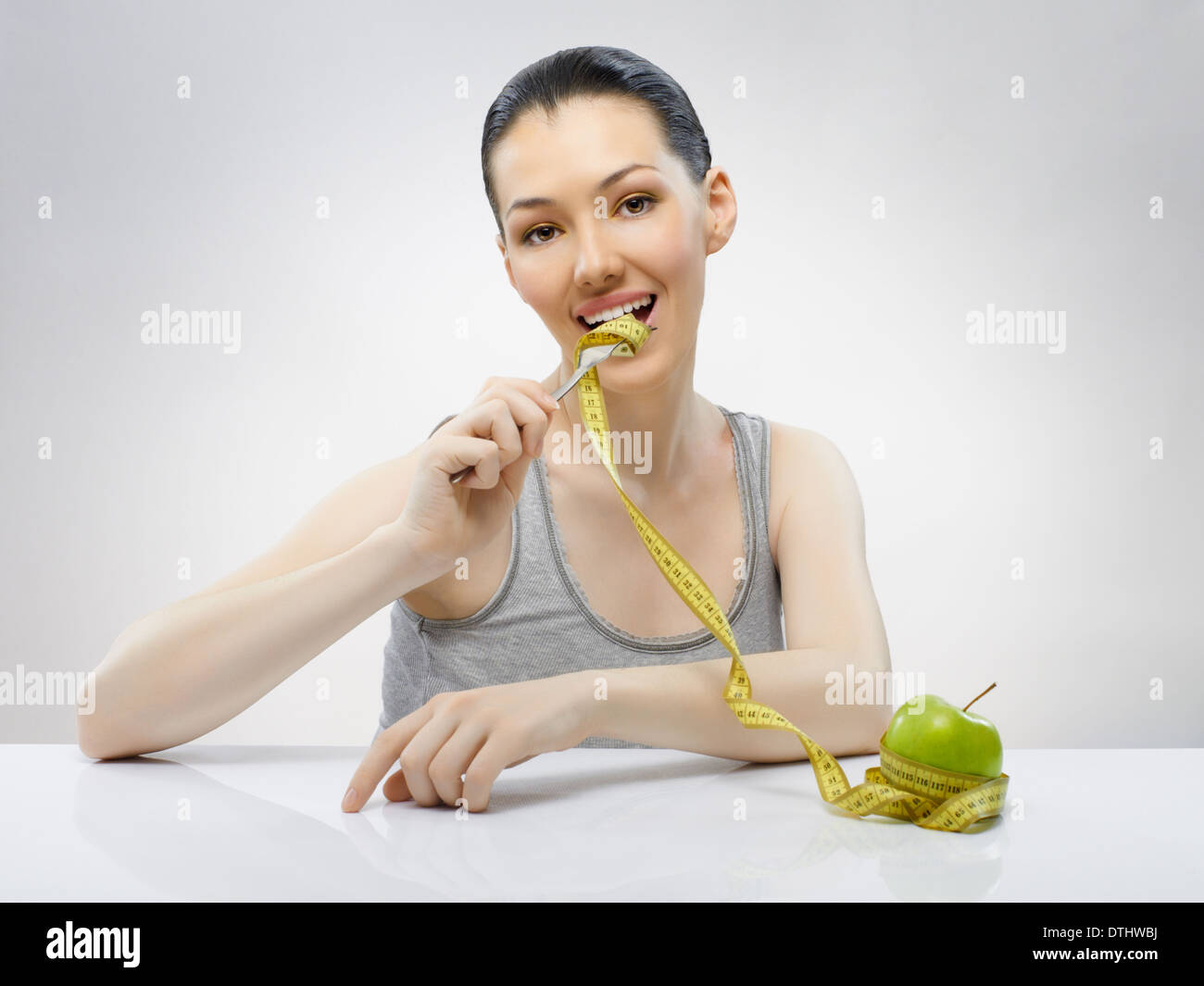 A beautiful slender girl eating healthy food Stock Photo - Alamy