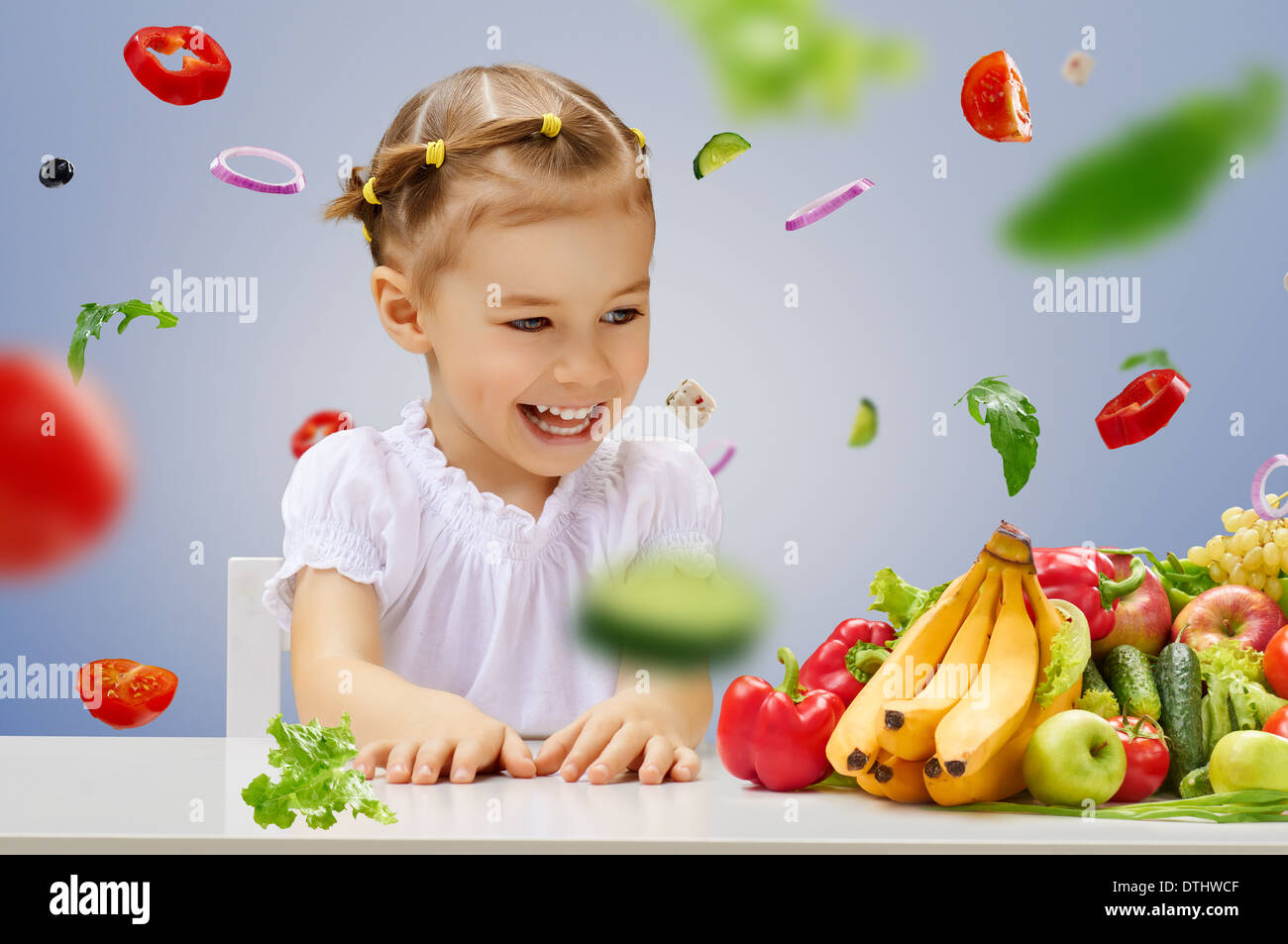 Child eating fruit and vegetables hi-res stock photography and images ...