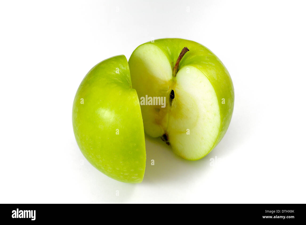 Granny Smiths apple split in 2 halves Stock Photo - Alamy