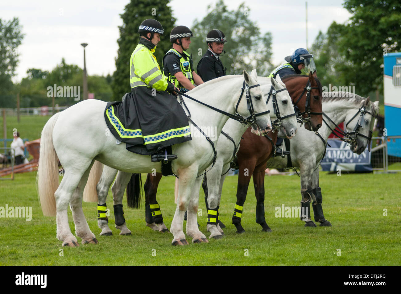 Four British mounted Police Officers on display at a Horse show Stock ...